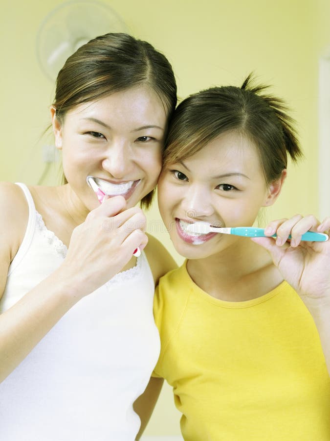 Ladies brushing teeth stock image. Image of fresh, contented - 7008515