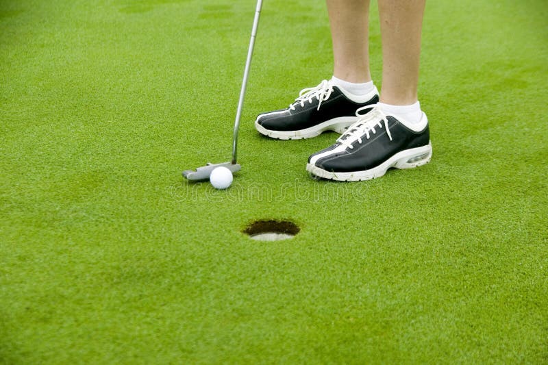 Ladies Feet And Golf Putter Stock Photo - Image of feet, putting: 1540718