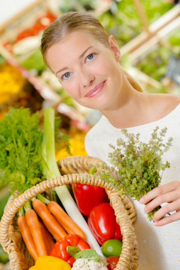Lady Adding Herbs To Purchases in Basket Stock Image - Image of basket ...