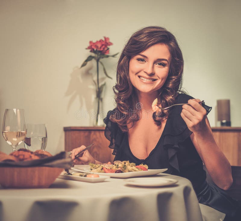 Lady alone in restaurant stock photo. Image of plate - 47732764