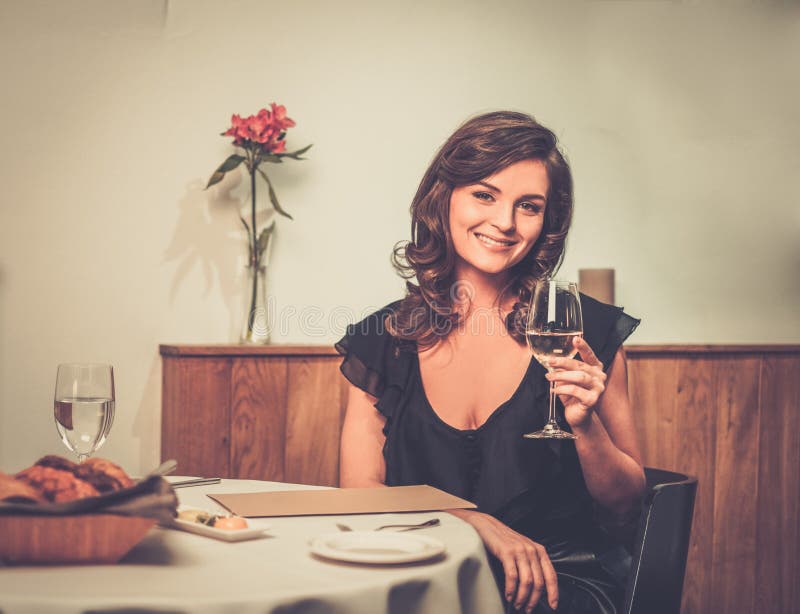 Lady alone in restaurant stock photo. Image of beautiful - 48584546