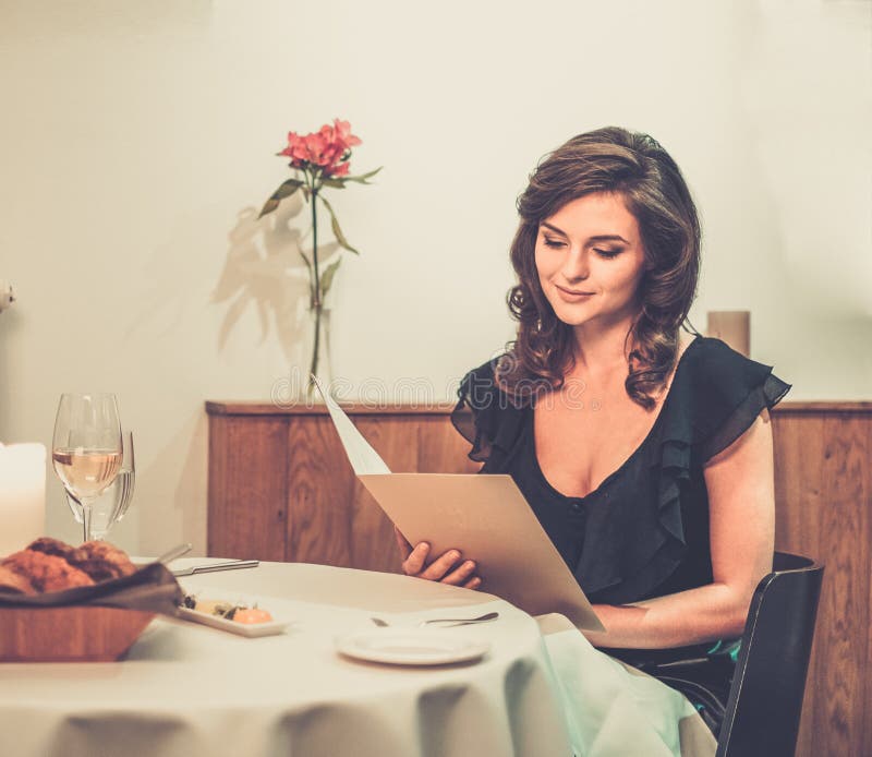 Lady alone in restaurant stock image. Image of dating - 47984783