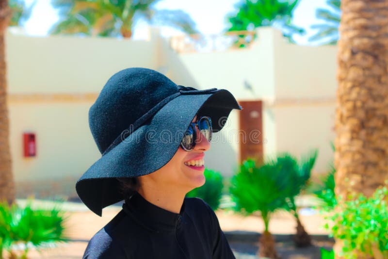 The Lady with the Black Hat Laughing and Having Fun Under the Sun Stock ...