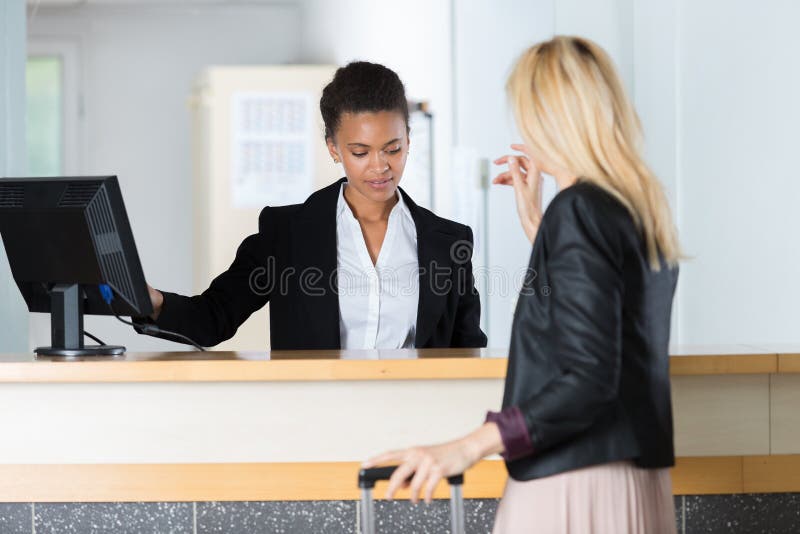 Lady Checking in at Hotel Reception Stock Image - Image of ...
