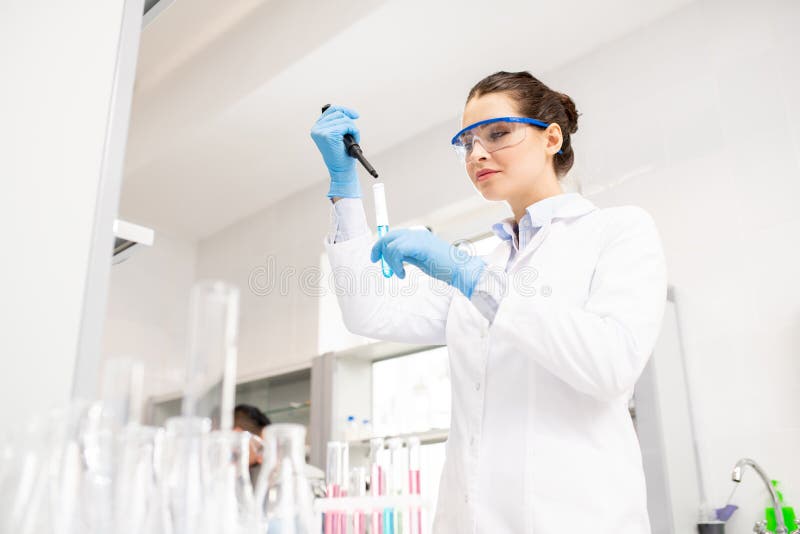 Lady Chemist Working with Reagents Stock Image - Image of young, rack ...