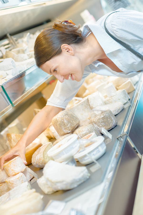 Lady Choosing Cheese from Counter Stock Photo - Image of hand, variety ...