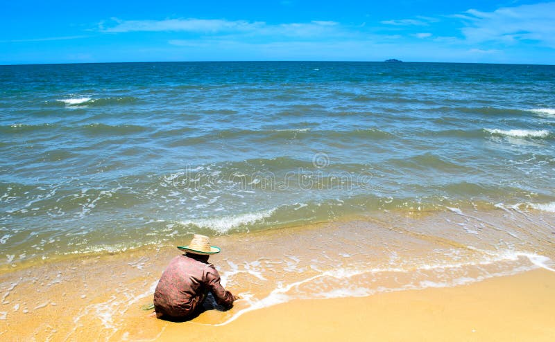 Lady Collecting Shells editorial photo. Image of digging - 60654276