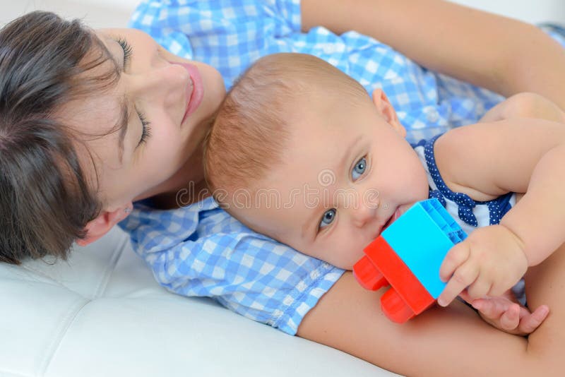 Lady cuddling baby stock photo. Image of bond, security - 162091570
