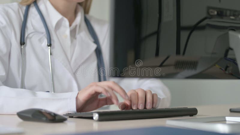 Close Up of Female Doctor Working on Desktop Computer in Clinic Stock ...