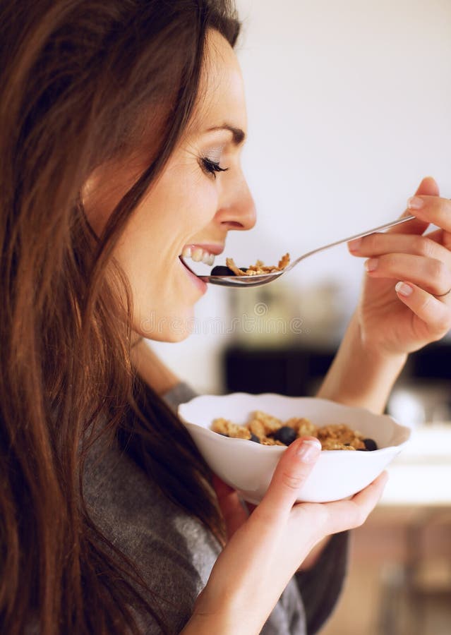 Lady Eating Her Cereal Indoors Stock Image - Image of attractive ...