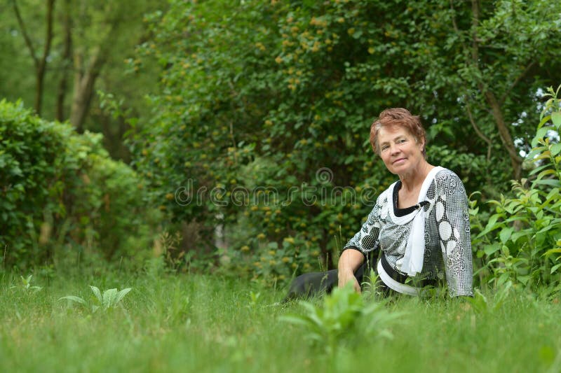 Lady enjoying summer stock photo. Image of green, elderly - 61260476
