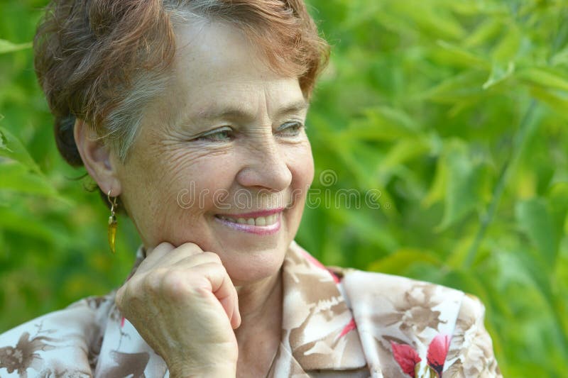 Lady enjoying summer stock image. Image of mature, garden - 62305963