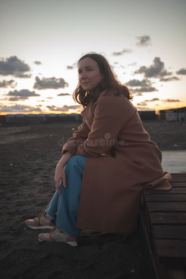 Lady Enjoys Tranquil Sunset Beach Walk. Stock Photo - Image of ...