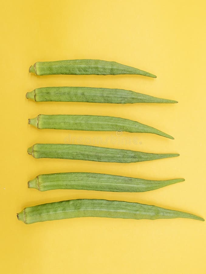 Lady Finger Isolated on Yellow Background, Selective Focus Stock Photo ...