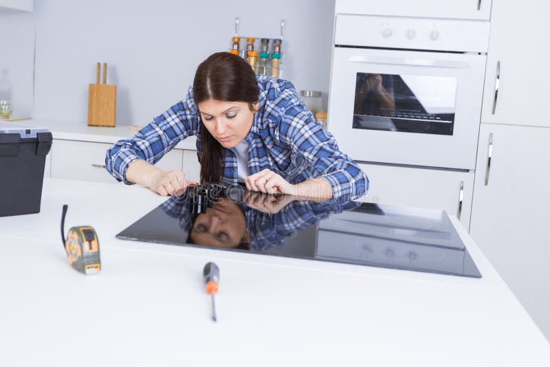 Lady Fitting Hob in Kitchen Stock Photo - Image of installation, cook ...