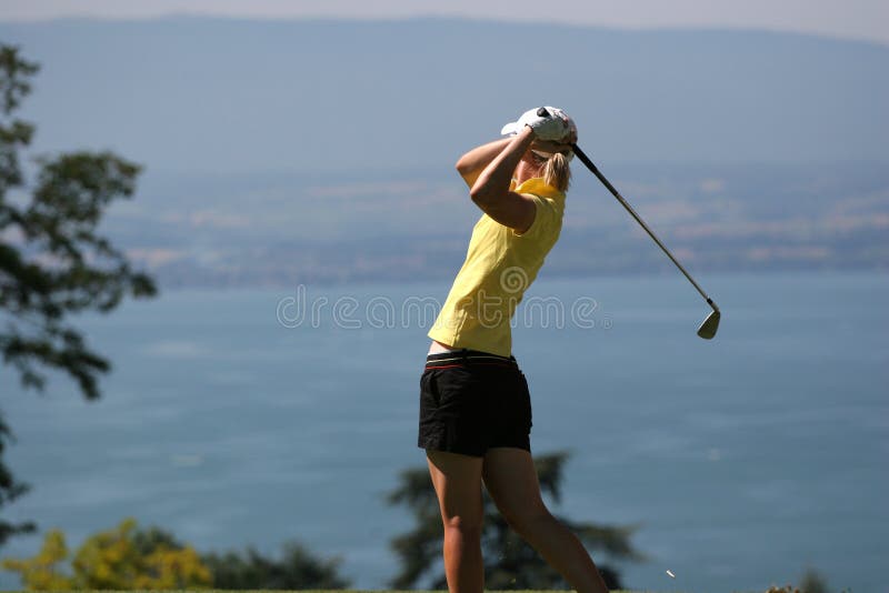 Lady Golf Swing at Leman Lake Stock Image - Image of sunshine, golfer ...
