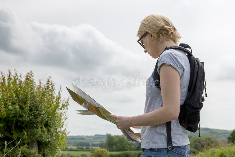 Lady Hiker Holding and Reading a Map in Sunny Outdoors Stock Photo ...
