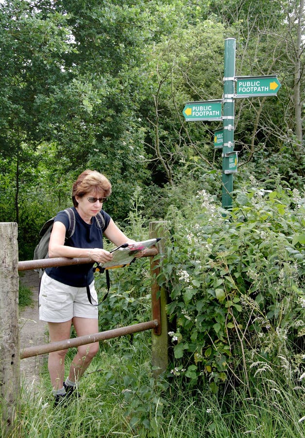 Lady Hiker reading a Map stock photo. Image of trees, lifestyle - 1401644