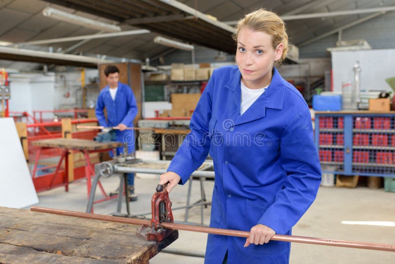 Lady Holding Copper Pipe in Vice Stock Image - Image of industrial ...