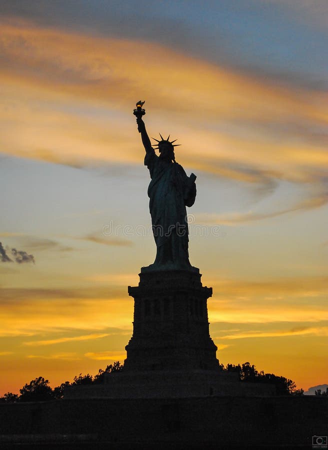 Lady Liberty at Sunset on Coast Stock Photo - Image of statueofliberty ...