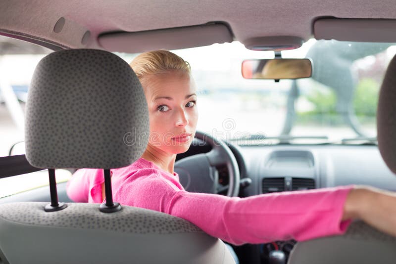 Lady Looking Back while Reversing. Stock Photo - Image of drive ...