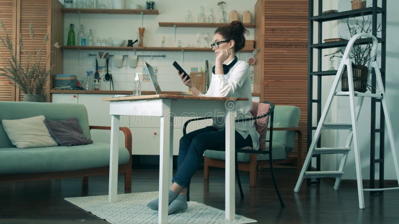 A Lady is Operating Gadgets while Working in Self-isolation Stock ...
