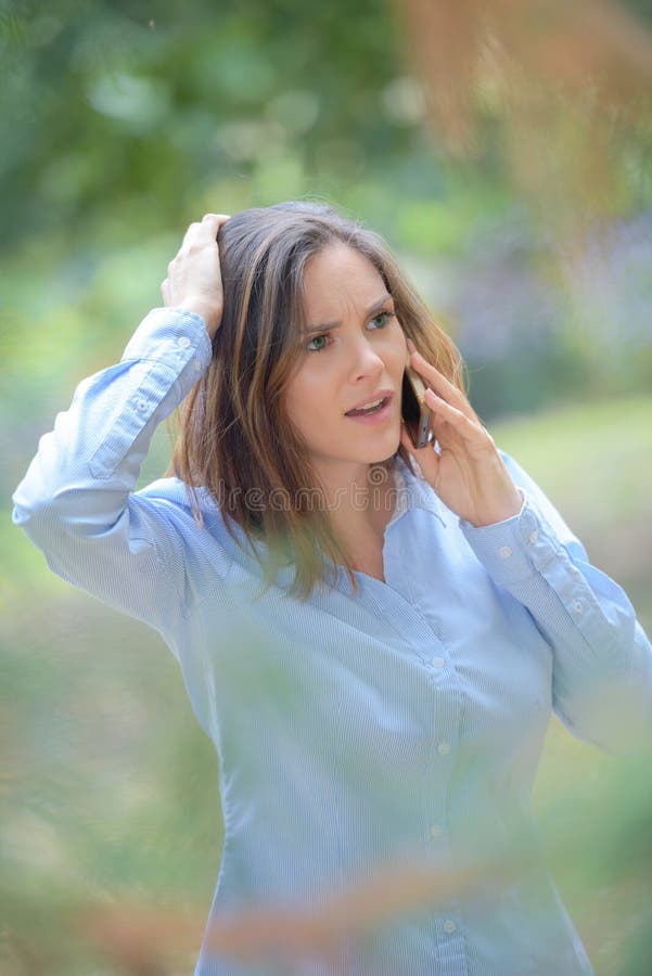 Lady Outdoors on Telephone Looking Distressed Stock Photo - Image of ...