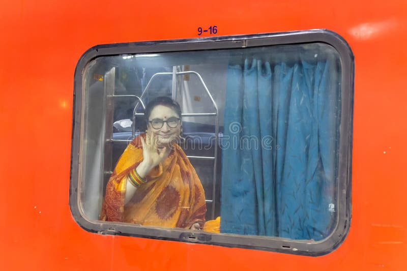 Lady Passenger Sitting Inside Train Looking Out the Window at Evening ...