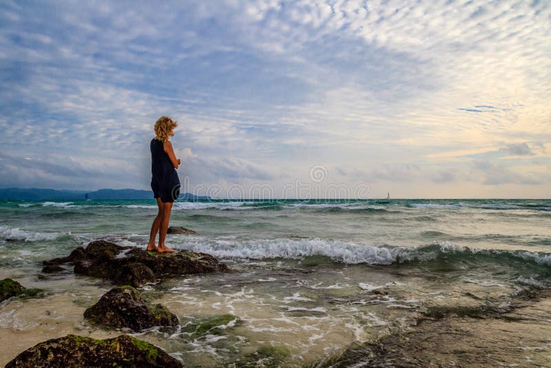 Lady on Rocks on the Coast, Boracay Island, Philippines Stock Image ...