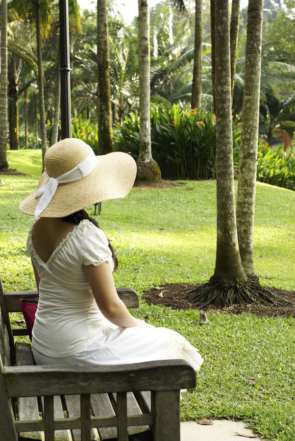 Lady seated in garden stock image. Image of park, outdoors - 9369591