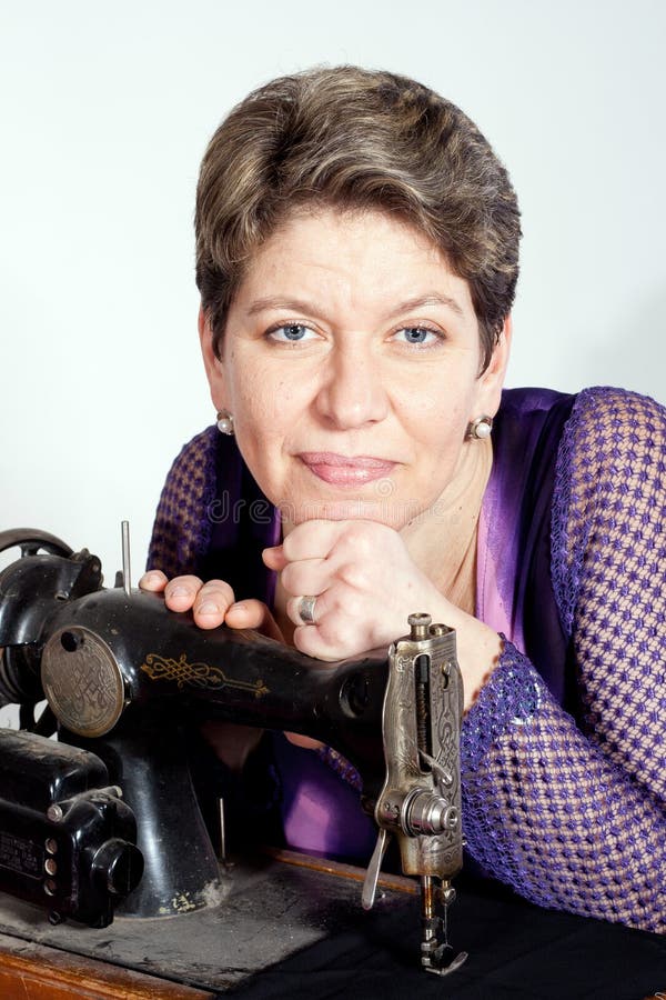 Lady Sewing With Vintage Sewing Machine Stock Photo - Image of clothing ...