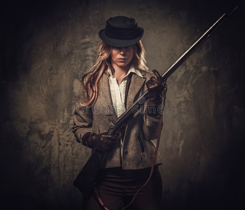 Lady with Shotgun and Hat from Wild West on Dark Background. Stock ...