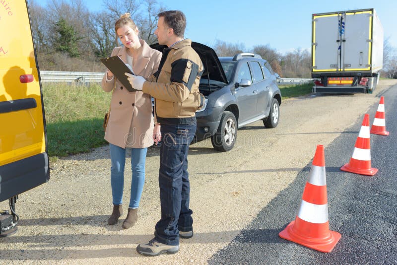 Lady Signing Paperwork for Recovery Driver Stock Photo - Image of ...
