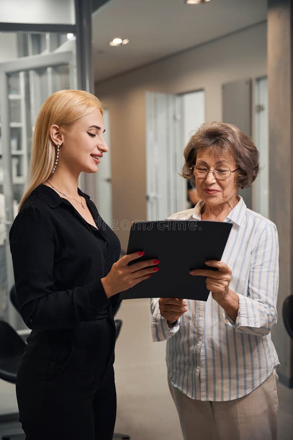 Lady Signs Documents in the Lobby of a Dental Clinic Stock Image ...