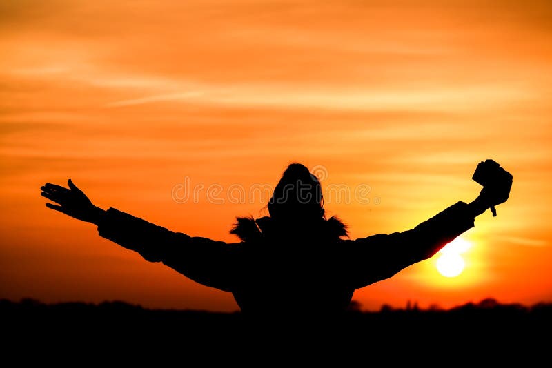 Lady Silhouette Embracing the Sun Stock Photo - Image of coulorful ...
