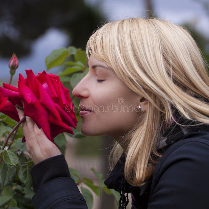 Lady Smelling a Rose Ih a Baroque Park Stock Photo - Image of leaf ...