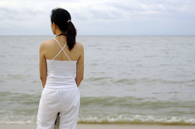 Lady Standing at the Beach stock image. Image of sand - 3549105
