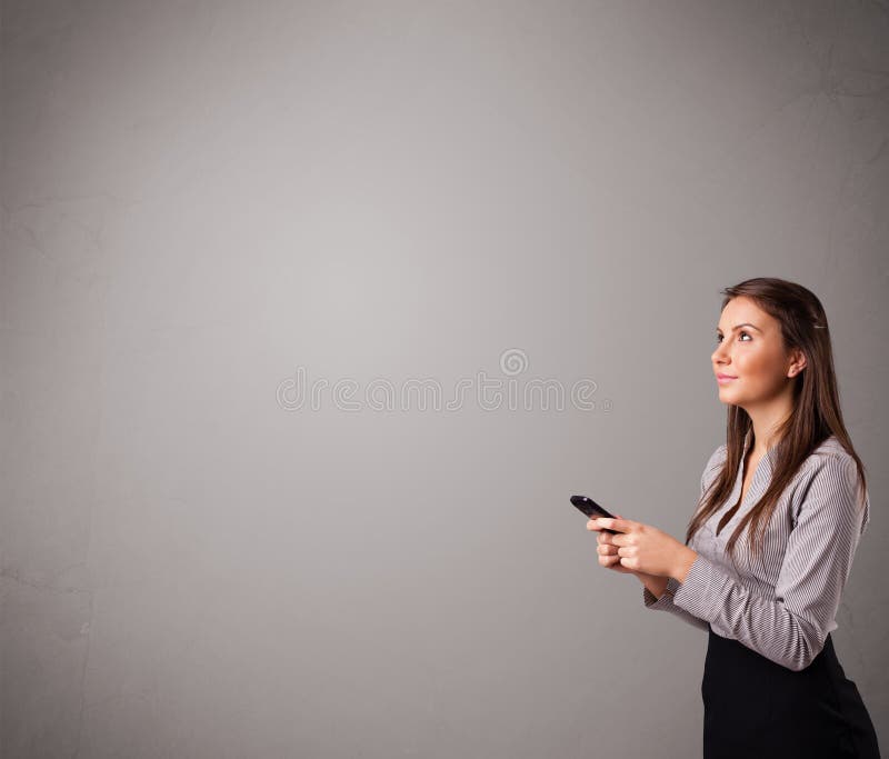 Lady Standing and Holding a Phone with Copy Space Stock Image - Image ...
