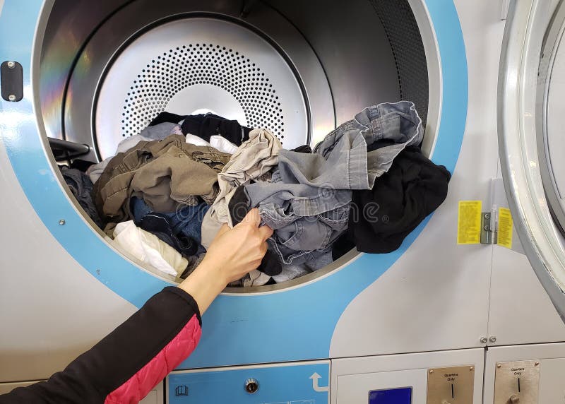 A Lady Take Dried Clothing Out from Machine Stock Photo - Image of ...