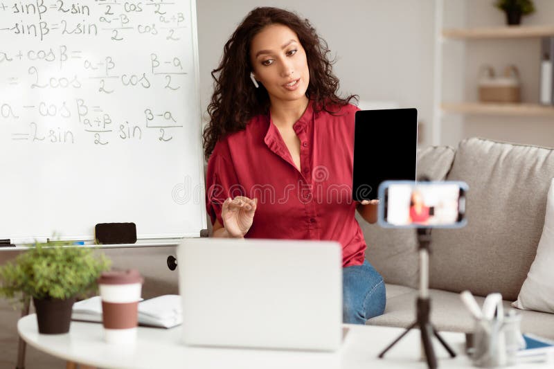 Lady Teacher Explaining Math Online Showing Tablet To Laptop Stock ...