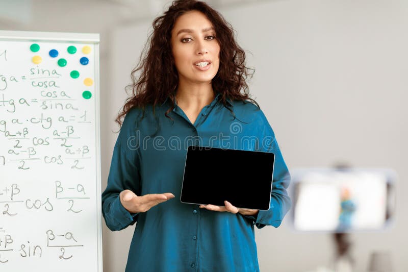 Lady Teacher Explaining Math Online Showing Tablet To Students Stock ...