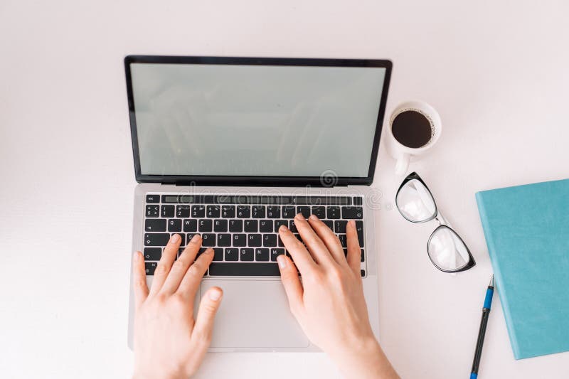 Lady is Typing on Laptop Keyboard at Table with Cup of Coffee and ...