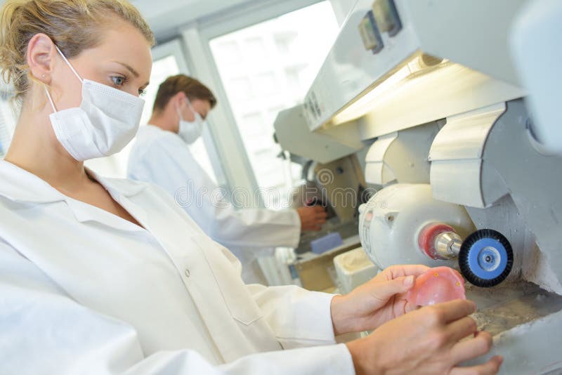 Lady Using Grinder To Manufacture False Teeth Stock Image - Image of ... Lady Using Grinder To Manufacture False Teeth Stock Image - Image of ...