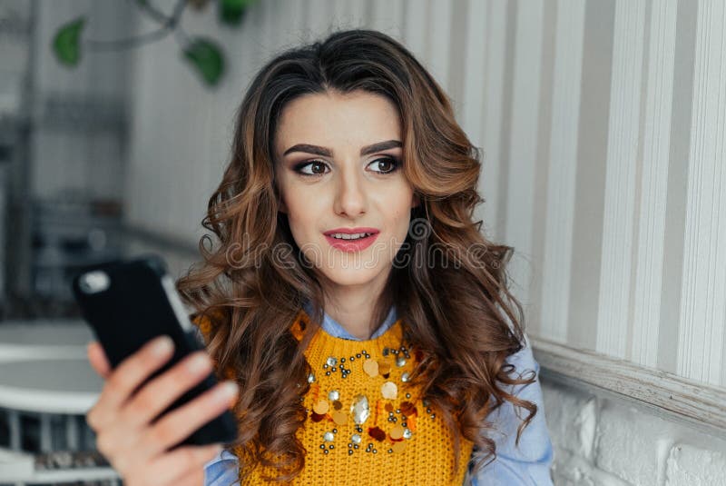 Lady using phone in a cafe stock image. Image of concepts - 68090791