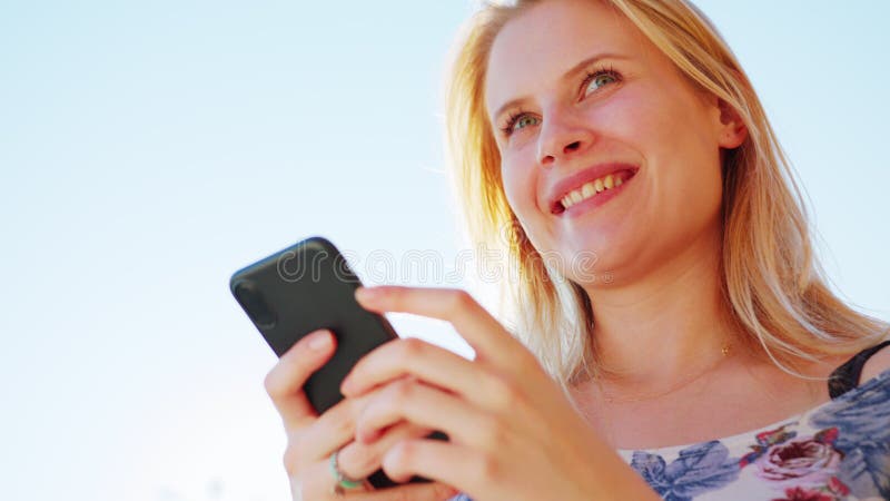 Lady Using a Phone Outdoors Stock Photo - Image of network, girl: 153556748