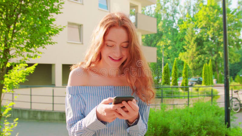 Lady Using a Phone Outdoors Stock Photo - Image of hand, internet ...