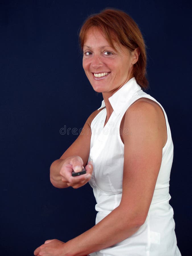Lady Using A Remote Control Picture. Image: 3551912