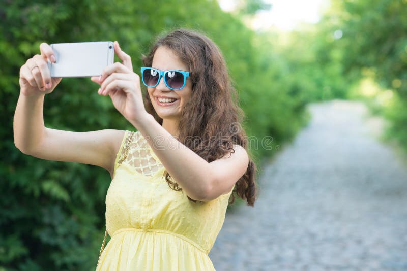 Lady Using Smartphone Camera To Take Selfie Stock Photo - Image of ...