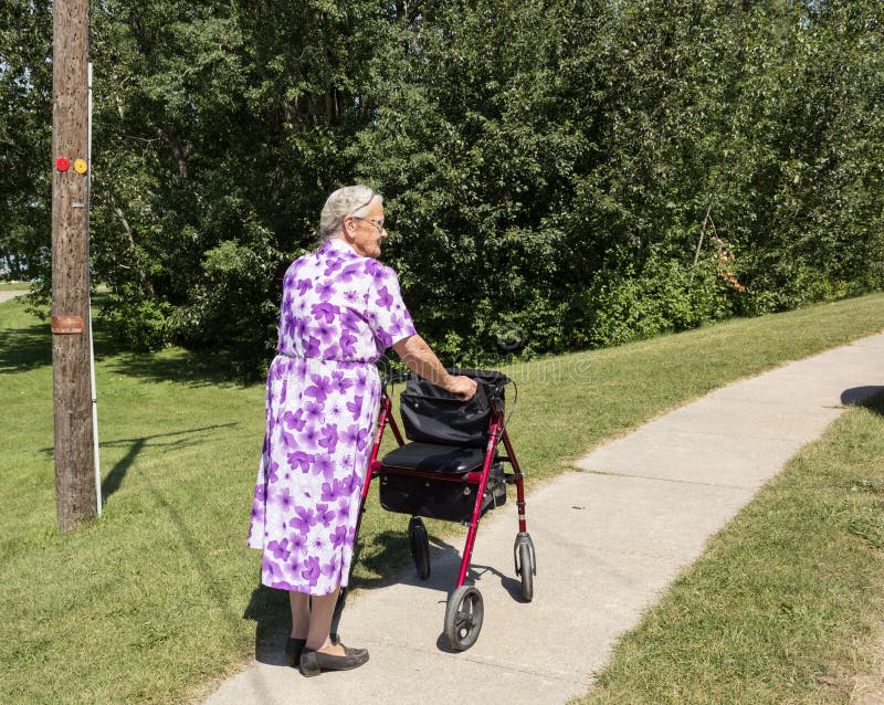 Lady with a walker stock photo. Image of hand, flowered - 58360656