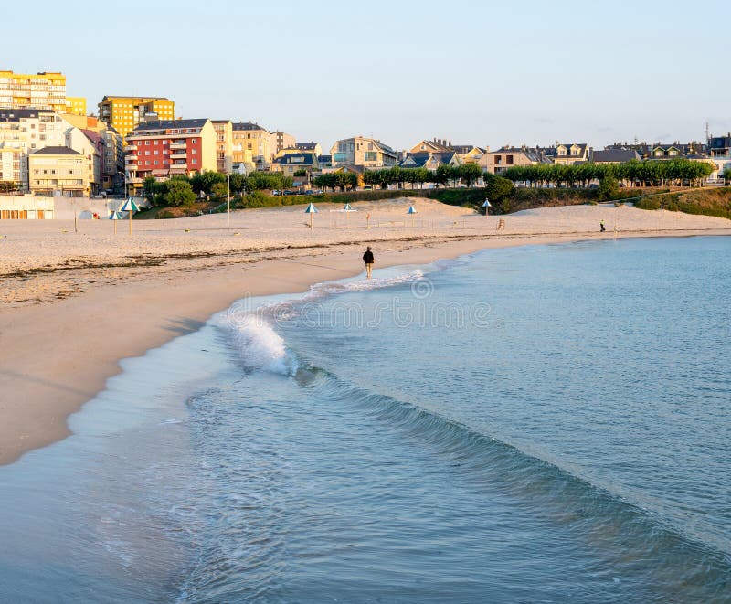 A Lady Walking Along a Lonely Beach Stock Image - Image of beach, lady ...